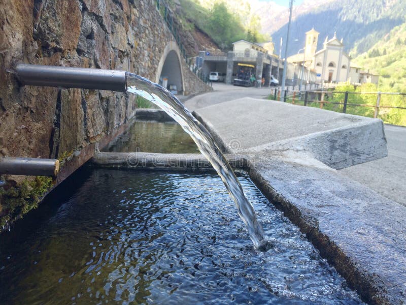 Woman Drinks Water from a Pure Mountain Spring. Natural Spring Water in ...