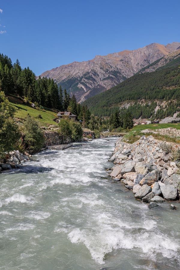 Mountain Stream and the Mountain Range of the Italian Alps on a Sunny ...