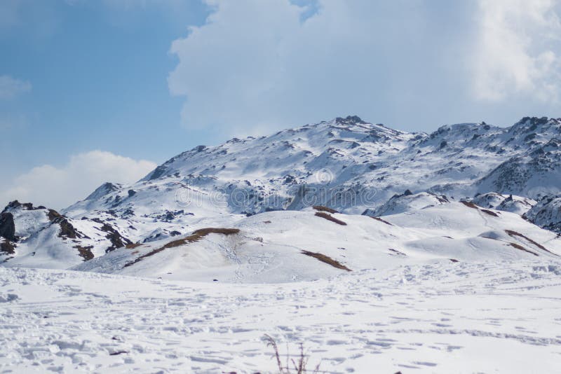 Mountain Top Covered by a Thick Layer of Snow Stock Photo - Image of ...