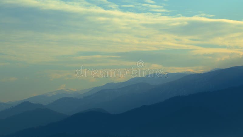 Mountain Top with Sunset. Clouds Float. Blue and Orange Clouds Flow in ...