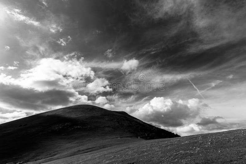 Mountain Top Under a Deep Sky, with White and Fluffly Clouds Stock ...
