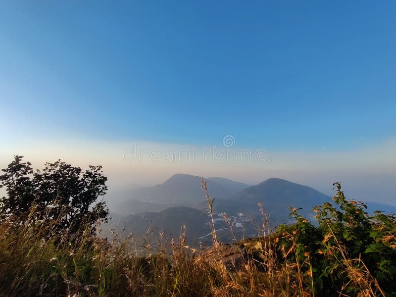 Mountain top view stock image. Image of silhouette, sunlight - 261238535