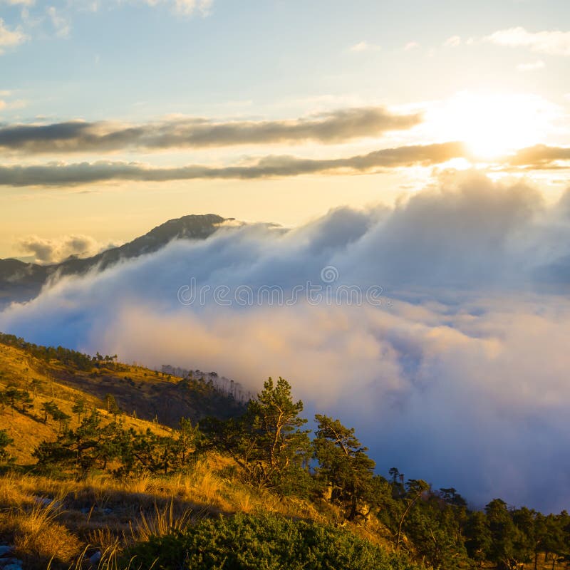 Mountain Valley at the Sunset in Mist and Clouds Stock Photo - Image of ...