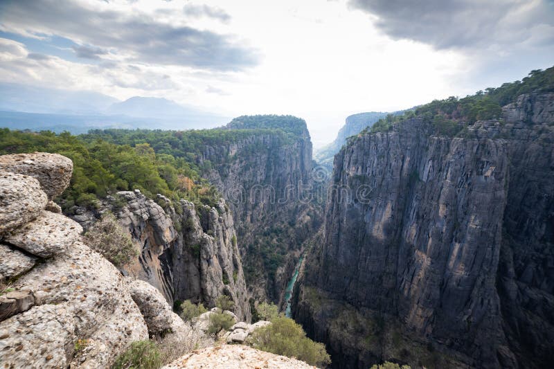 Mountain Valleys and a Little Blue Stream Flowing between the Rocks ...