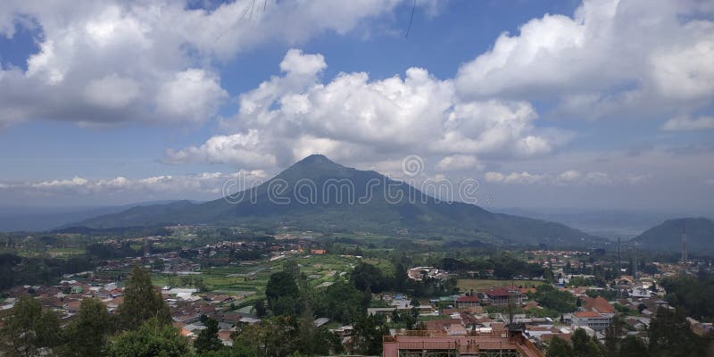 Mountain and village stock photo. Image of cloud, mountain - 222084162
