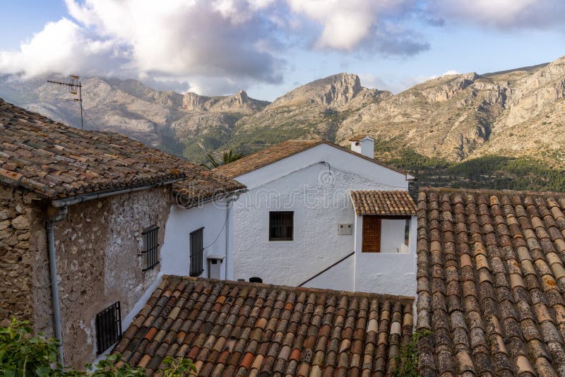 Mountain Village and Rooftops with Mountain Landscape in the Background ...