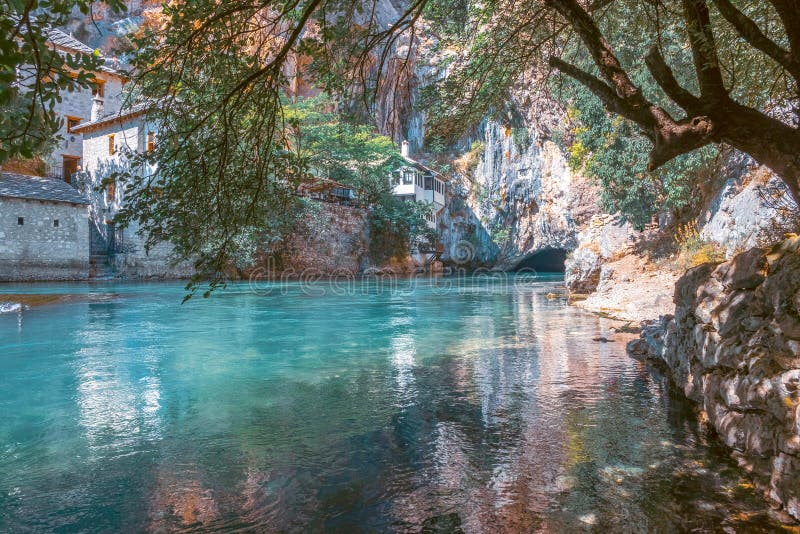 Mountain Water Spring with a Lake Under a Large Rock Stock Photo ...