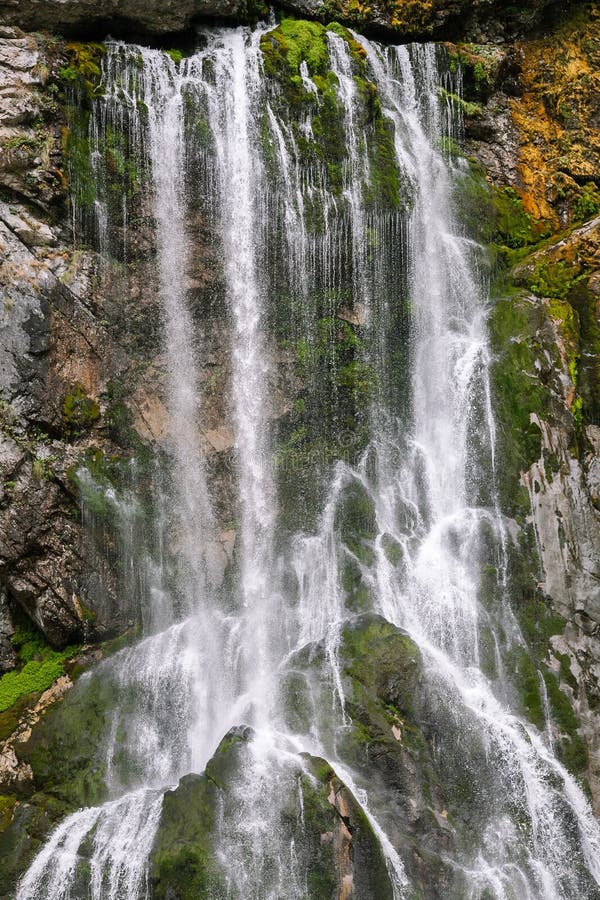 A Mountain Waterfall. a Strong Stream of Water Dropping Down among ...
