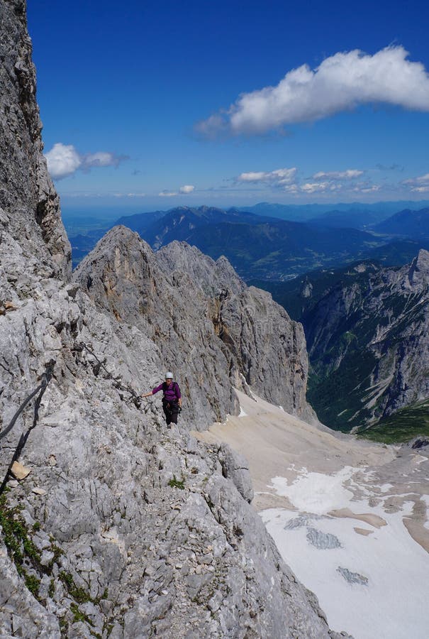 Mountaineer Woman on a Rocky Face of a Mountain Stock Photo - Image of ...