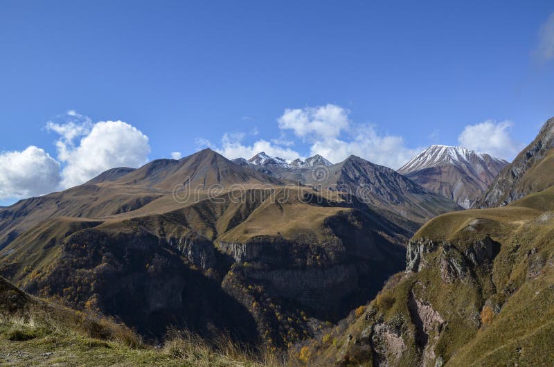 Mountainous Landscape with Steep Cliffs and Deep Valleys Covered Brown ...