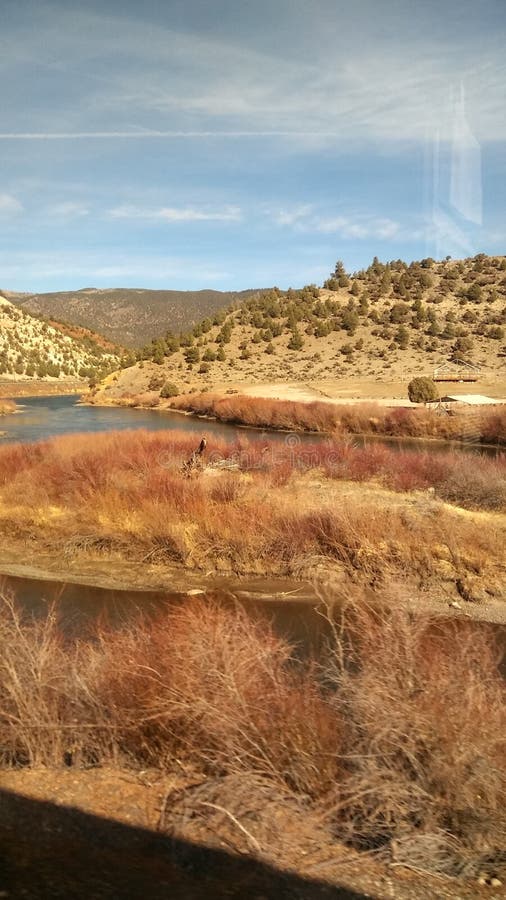 Mountains and Brown Grasses Stock Photo - Image of running, lighting ...