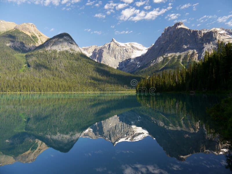 Mountains and Clouds Reflected in a Mountain Lake. Stock Image - Image ...