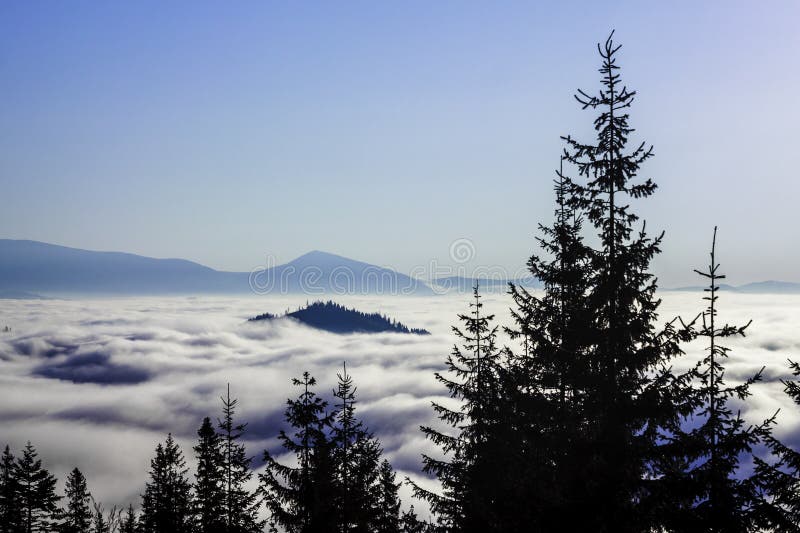 Mountains Protrude from the Clouds Stock Image - Image of cloud, nature ...