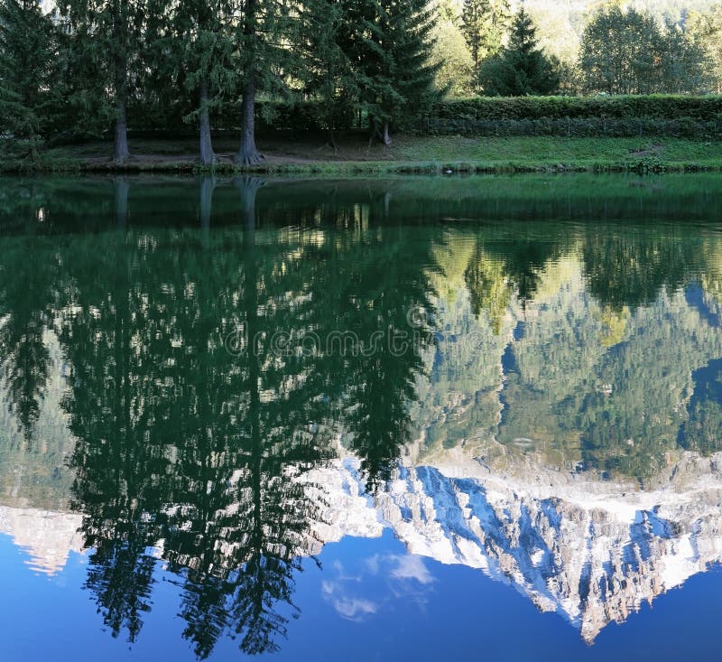 The Mountains Reflected in the Smooth Water of the Lake Stock Image ...