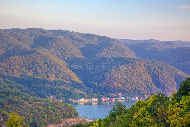 Mountains on the riverside stock photo. Image of sunrise - 140333872
