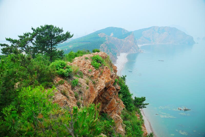 Mountains at sea shore stock photo. Image of coast, sand - 10247750