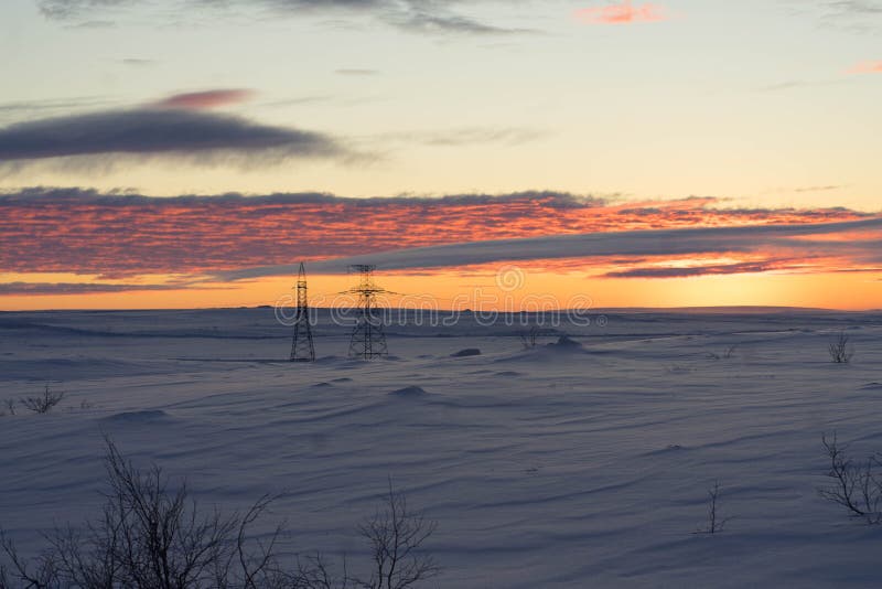 Mountains of Snow on the Background of the Rising Sun and Clouds Stock ...