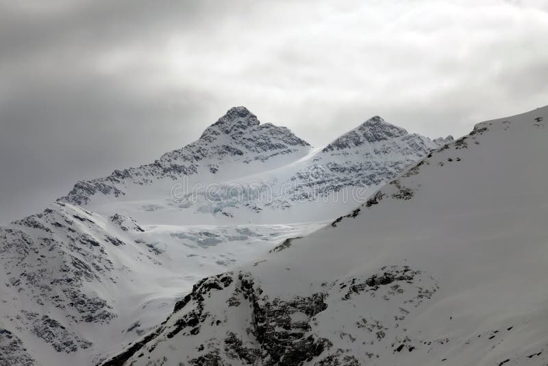 Mountains in Snow in Cloudy Weather Stock Photo - Image of nature ...