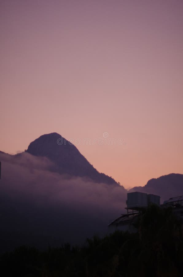 Mountains at Sunset with Fog Casts a Pink Color Stock Image - Image of ...
