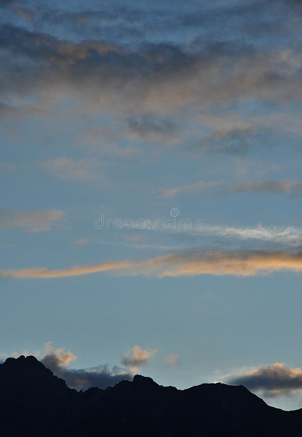 Mountains at the sunset stock image. Image of evening - 332293547