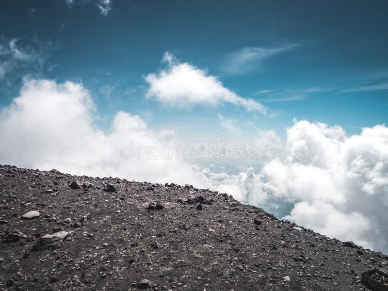 In the Mountains on a Volcano Above the Clouds Stock Image - Image of ...