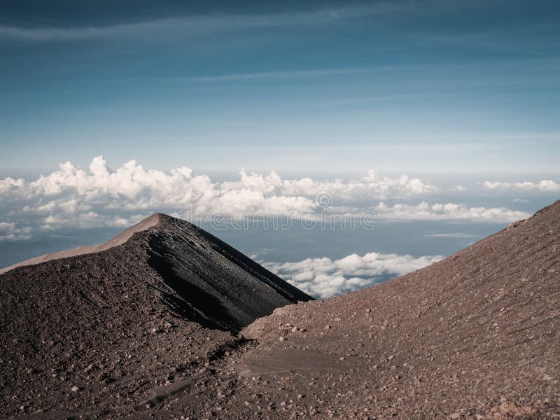 In the Mountains on a Volcano Above the Clouds Stock Photo - Image of ...