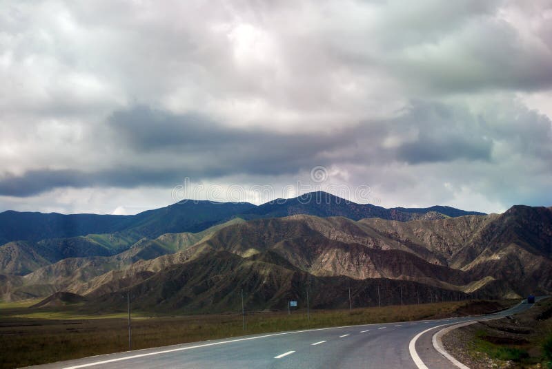 Camper on overcast highway stock photo. Image of distant - 10071274