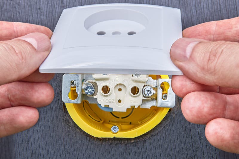 Installing Top Panel on Household Electrical Outlet. Stock Image ...