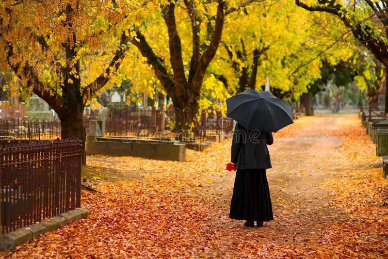 Woman Mourning at Cemetery stock image. Image of graveyard - 2404973
