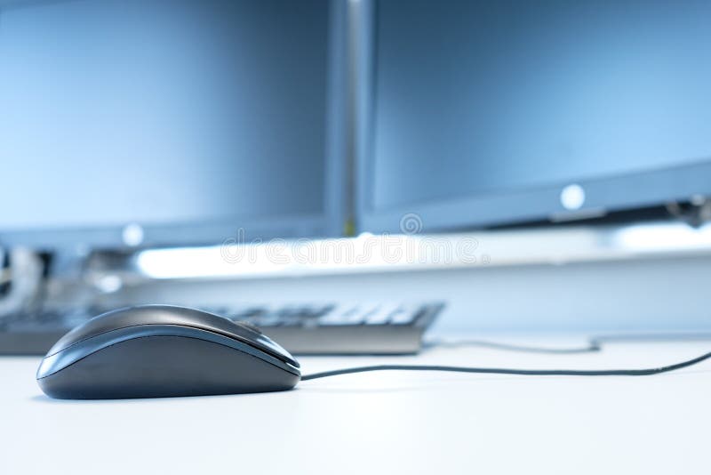 Mouse at a Computer with Monitors Stock Photo - Image of cable, bokeh ...
