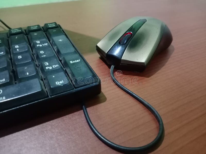 Mouse and Keyboard on a Brown Desk Stock Photo - Image of screenshot ...