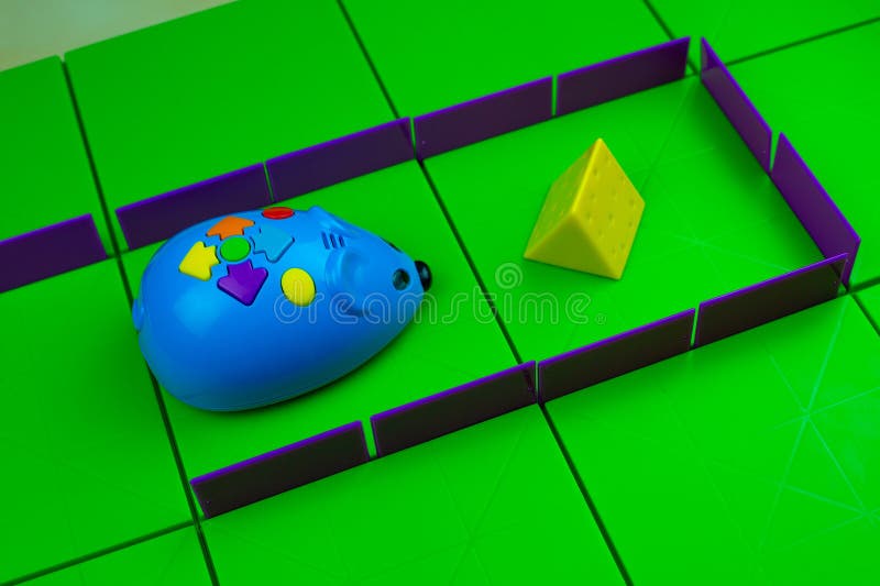 Mouse toy catches cheese stock image. Image of maze - 307111577