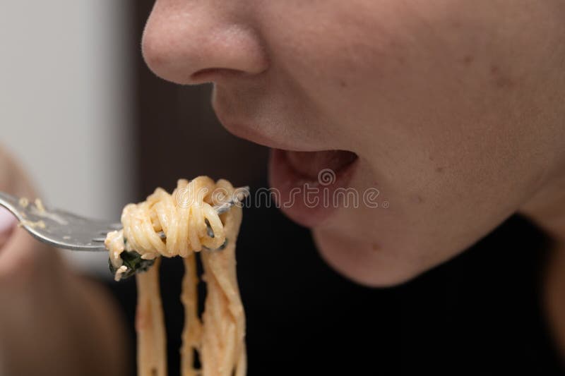 Mouth Eats Spaghetti. Close-up Shot of the Eating Process Stock Photo ...