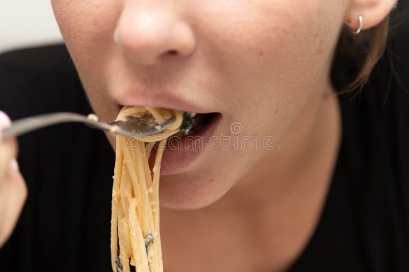 Mouth Eats Spaghetti. Close-up Shot of the Eating Process Stock Photo ...