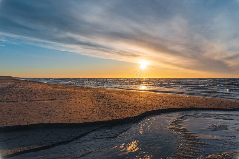 Mouth of a Stream, Sunset at Sea Stock Photo - Image of dawn, dusk ...