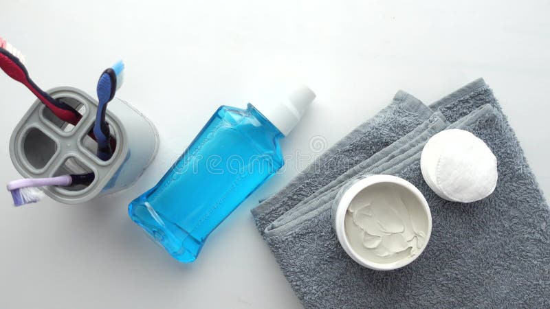 Mouthwash Liquid in a Container and Toothbrush on Table Stock Video ...