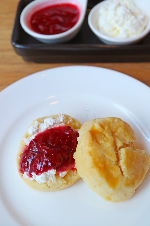 Scone Topped with Whipped Cream and Raspberry Jam Stock Image - Image ...