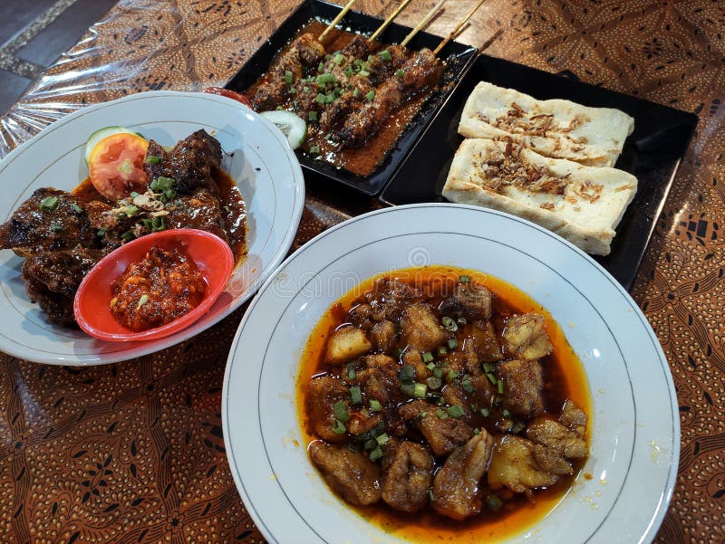 A Mouthwatering Spread of Indonesian Cuisine on a Table Adorned with a ...