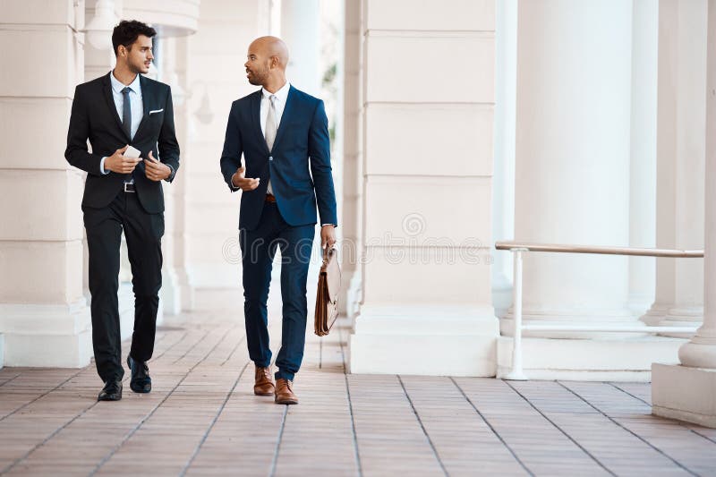 Move in the Direction of Business. Young Handsome Businessmen Talking ...
