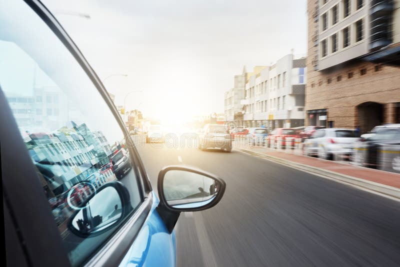 Always on the Move. Shot of a Car Driving on a Road. Stock Photo ...