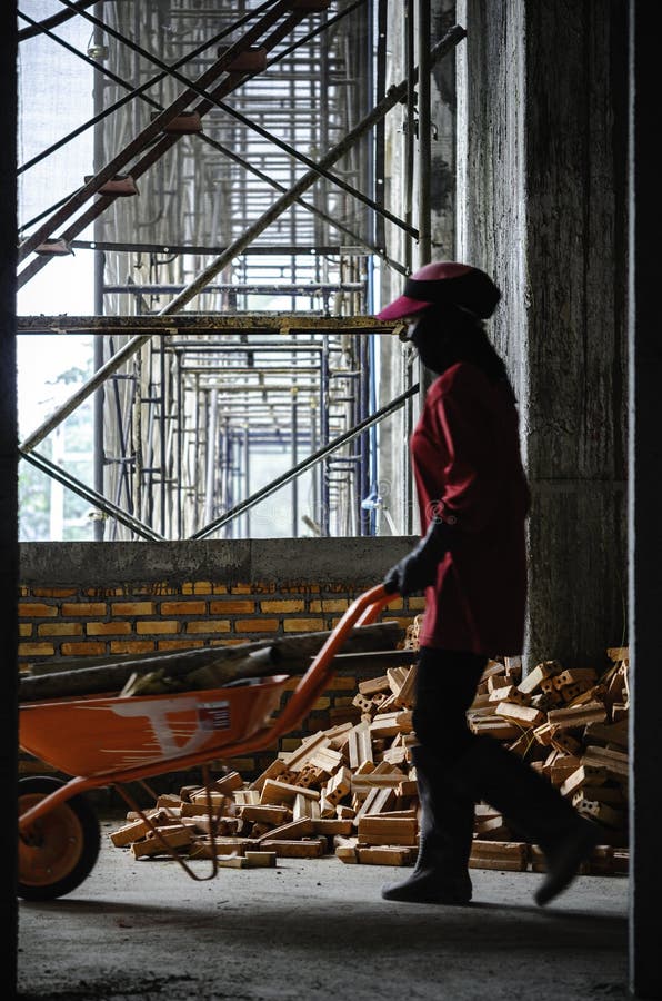 The Movement of the Construction Worker Using . Pushing, Wheels Cement ...