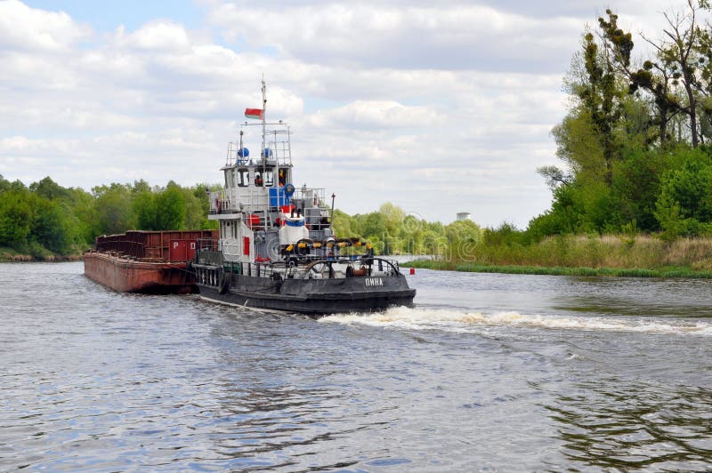 Movement of a Tugboat with a Barge Along the Pripyat River Editorial ...