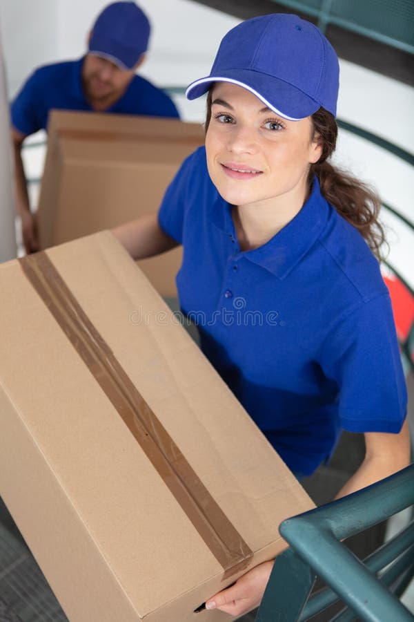 Movers Carrying Cardboard Boxes on Staircase Woman in Front Stock Image ...