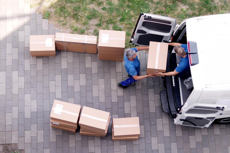 Movers Carrying Heavy Boxes while Moving Stock Photo - Image of service ...