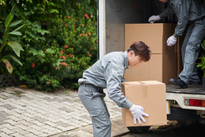 Movers Loading Truck stock image. Image of apartment - 268536449