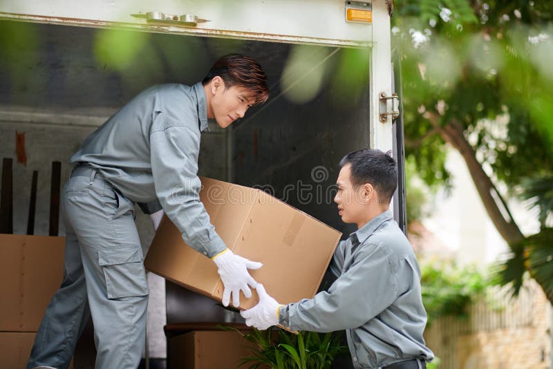 Movers Loading Truck stock photo. Image of belongings - 268536282
