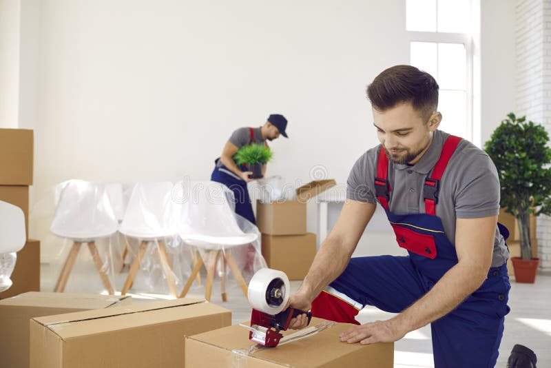 Movers Pack Boxes Moving Client Belongings Stock Photo - Image of ...
