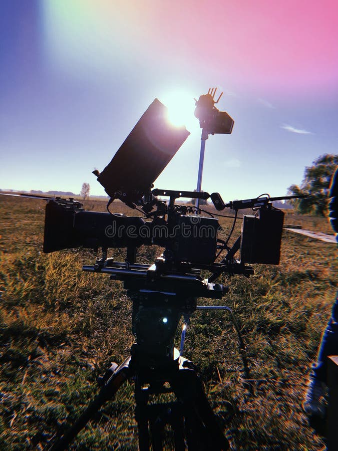 Movie Camera on a Tripod in the Field Stock Image - Image of digital ...