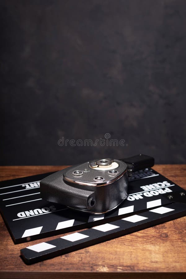 Movie Clapper Board and Film Retro Camera at Table Stock Photo - Image ...