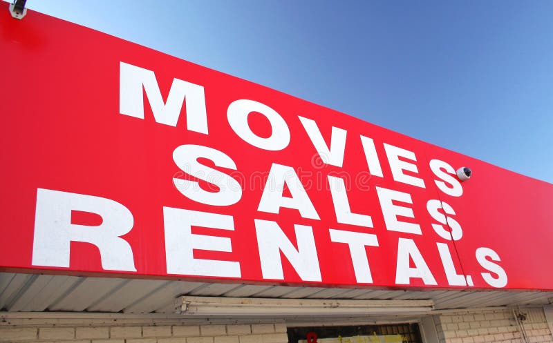 Movie Rental Sign on Convenience Store Stock Photo - Image of sign ...